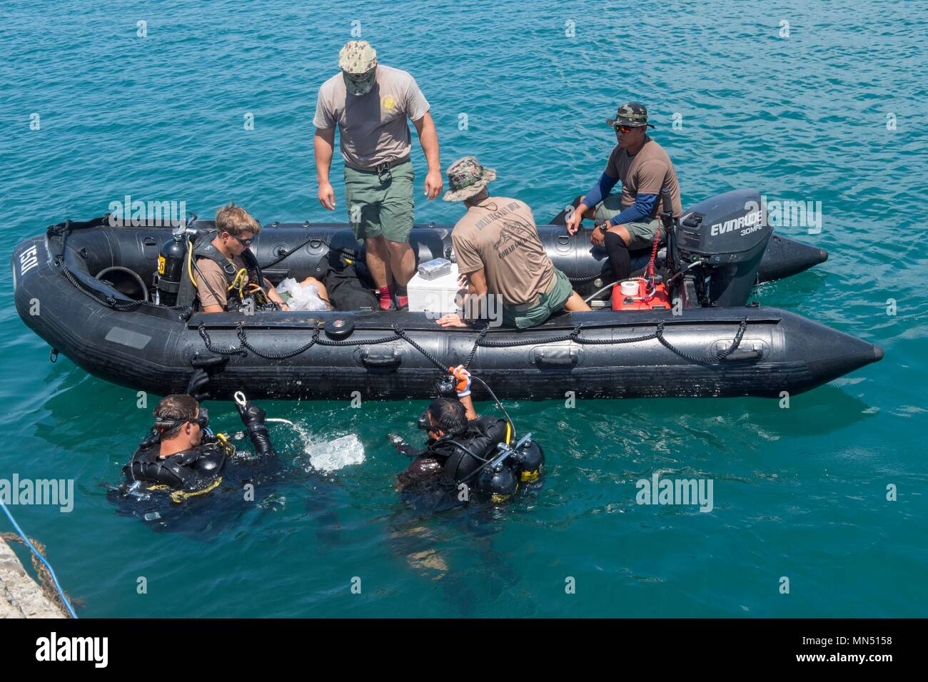 U.S. Navy Sailors attached to Underwater Construction Team (UCT) 2, and ...