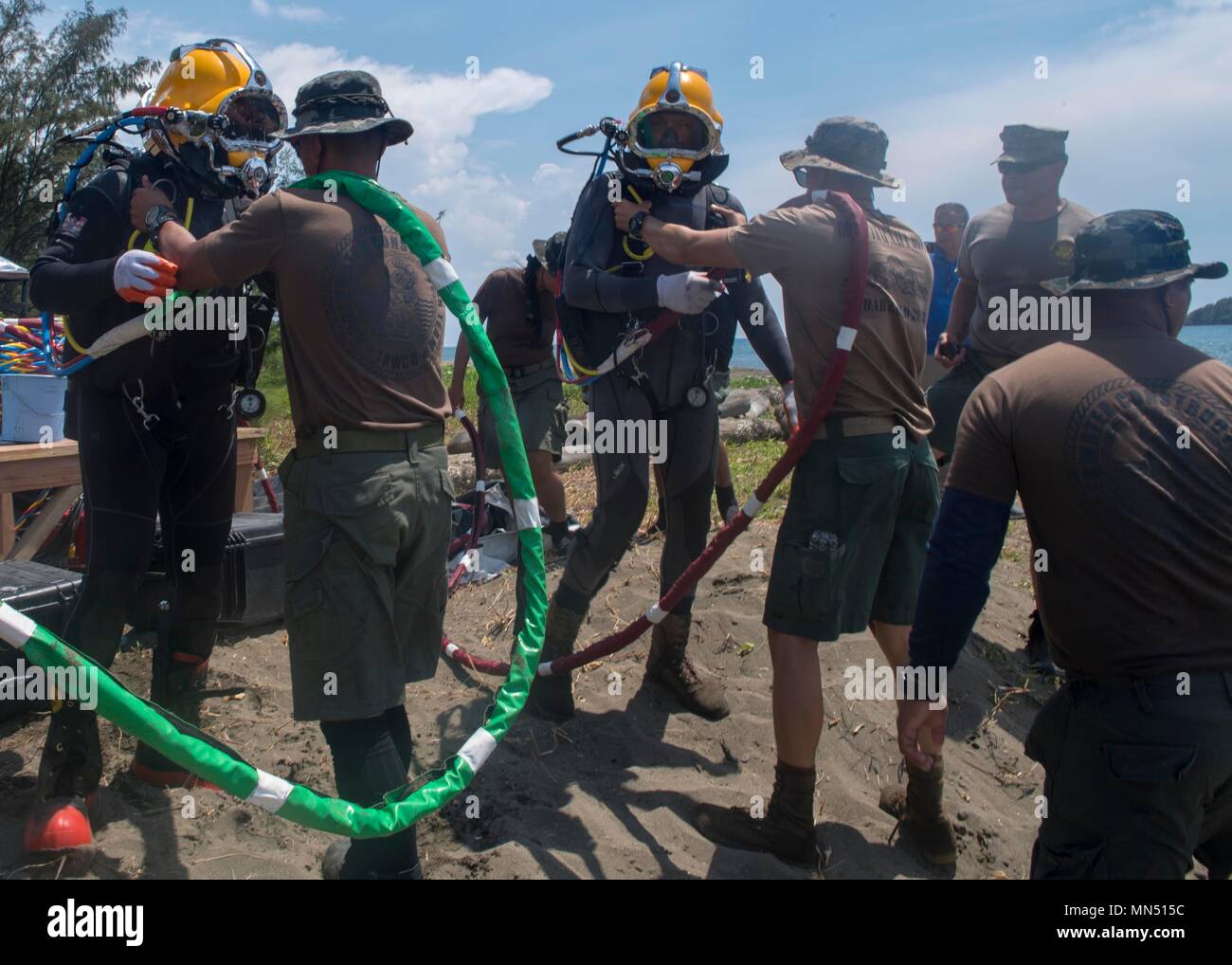 U.S. Navy Sailors attached to Underwater Construction Team (UCT) 2, and ...