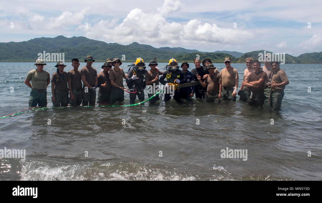U.S. Navy Sailors attached to Underwater Construction Team (UCT) 2, and ...