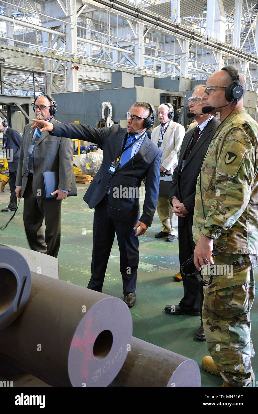 Arsenal Chief of Manufacturing John Zayhowski, center pointing ...