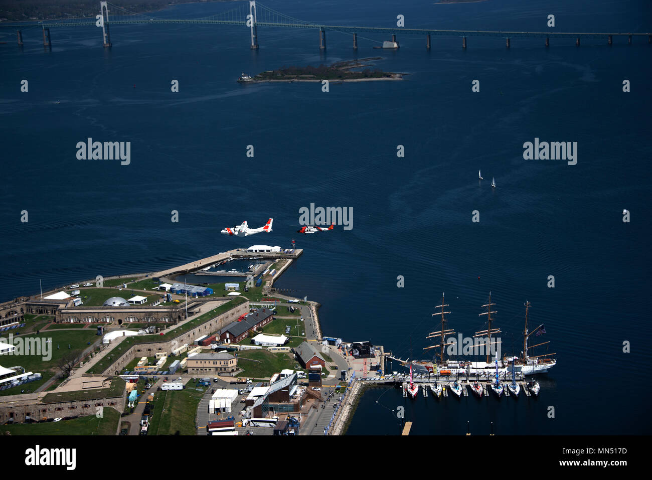 A Coast Guard Air Station Cape Cod HC-144 Ocean Sentry aircraft and an ...