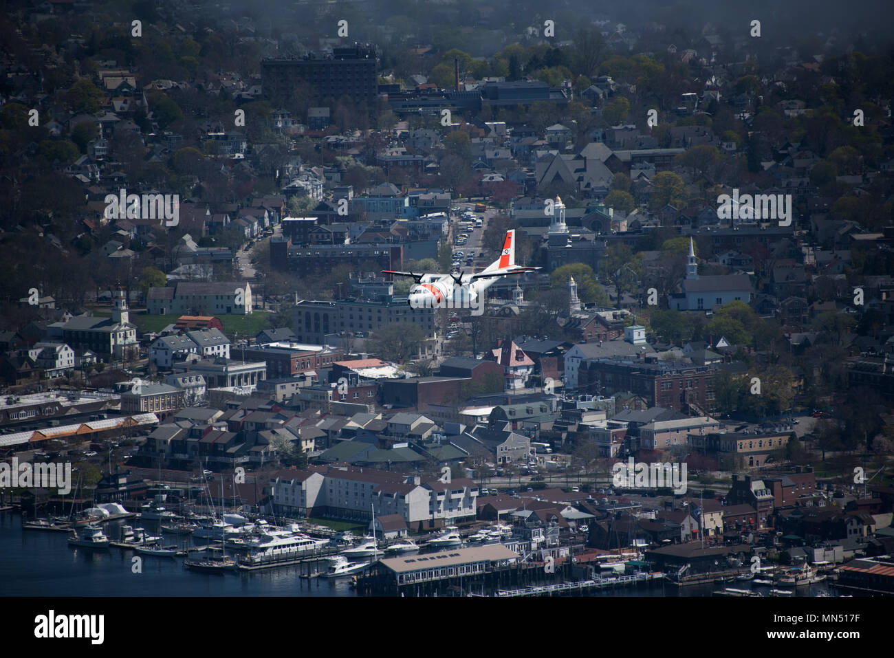 A Coast Guard Air Station Cape Cod HC-144 Ocean Sentry airplane flies ...