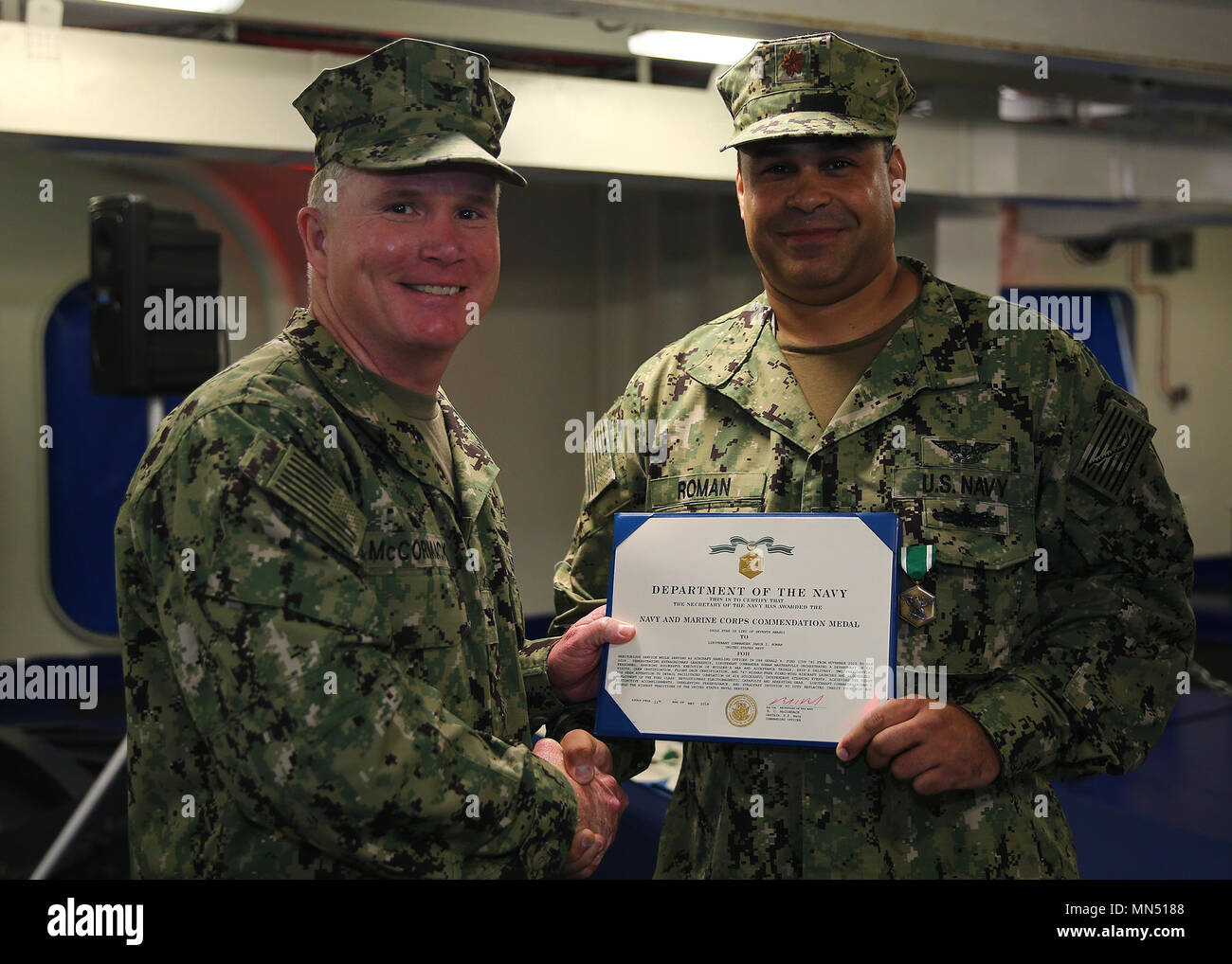 NORFOLK, Va. (May 8, 2018) -- Lt. Cmdr. Jaime Roman receives the Navy ...
