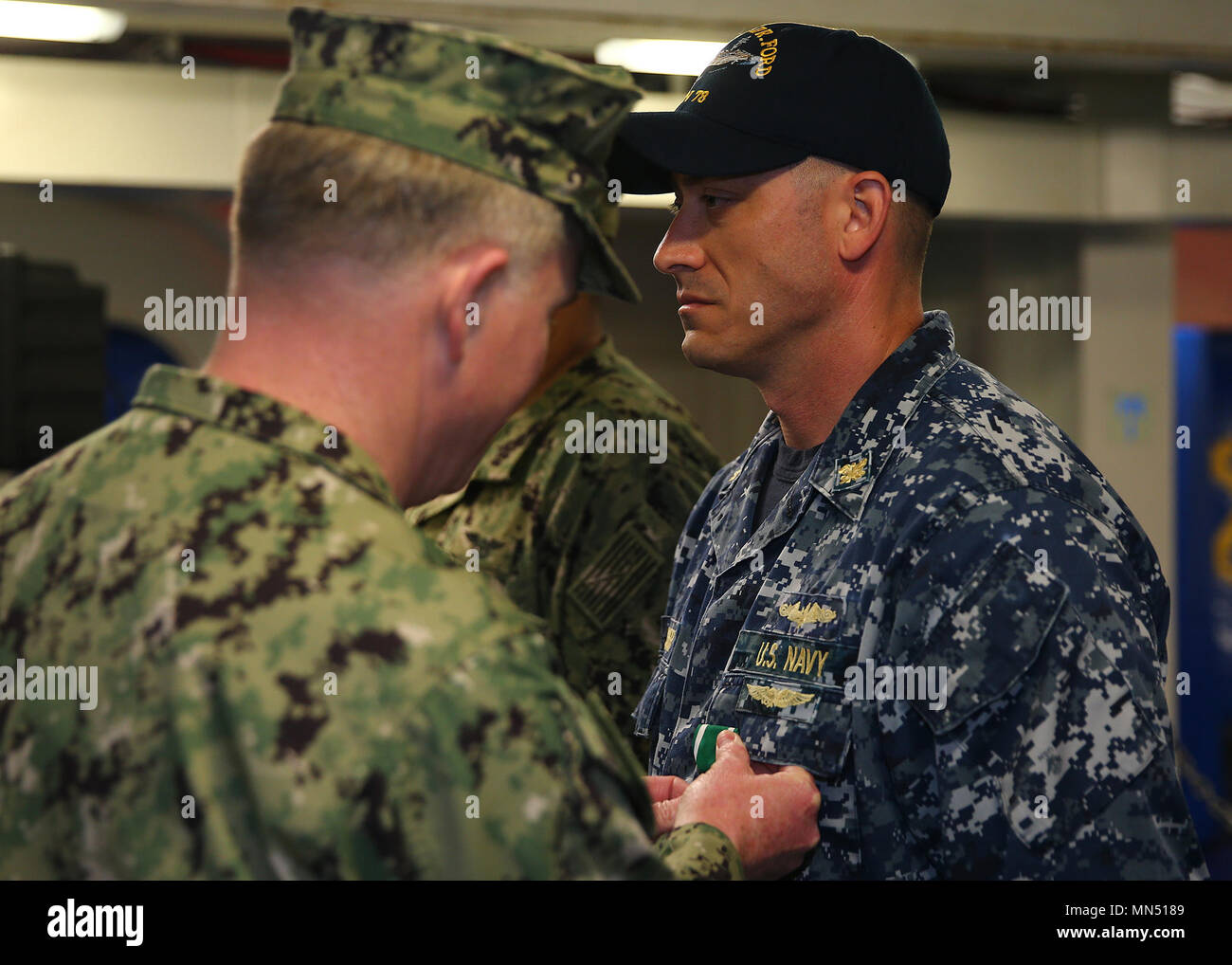 NORFOLK, Va. (May 8, 2018) -- Lt. Cmdr. Joshua Fischer receives the ...