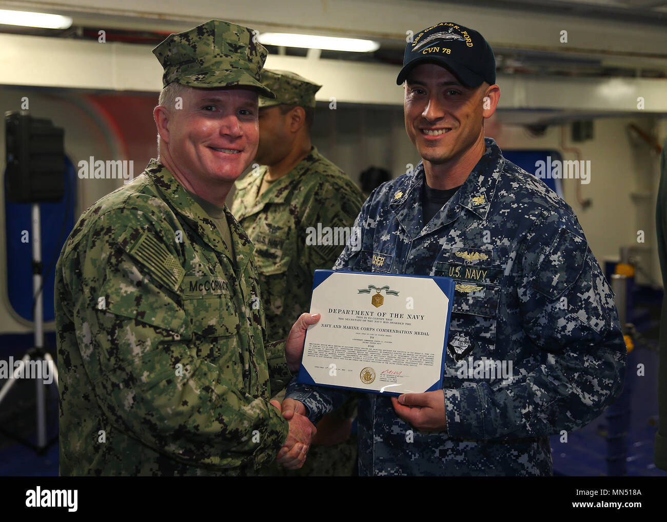 NORFOLK, Va. (May 8, 2018) -- Lt. Cmdr. Joshua Fischer receives the ...