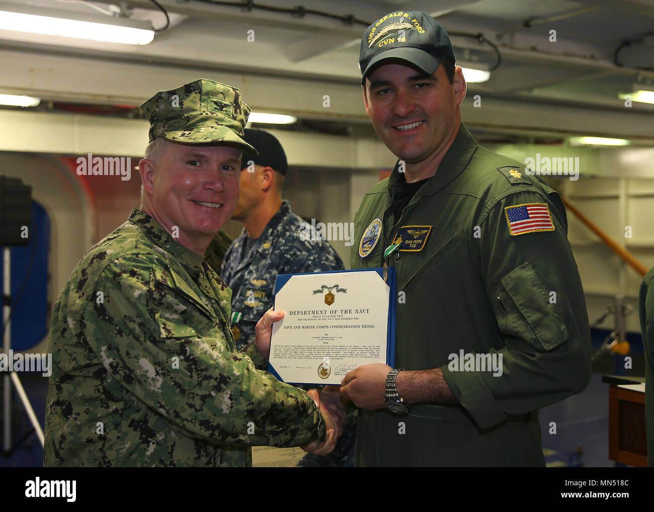 NORFOLK, Va. (May 8, 2018) -- Lt. Cmdr. Dan Pope receives the Navy and ...