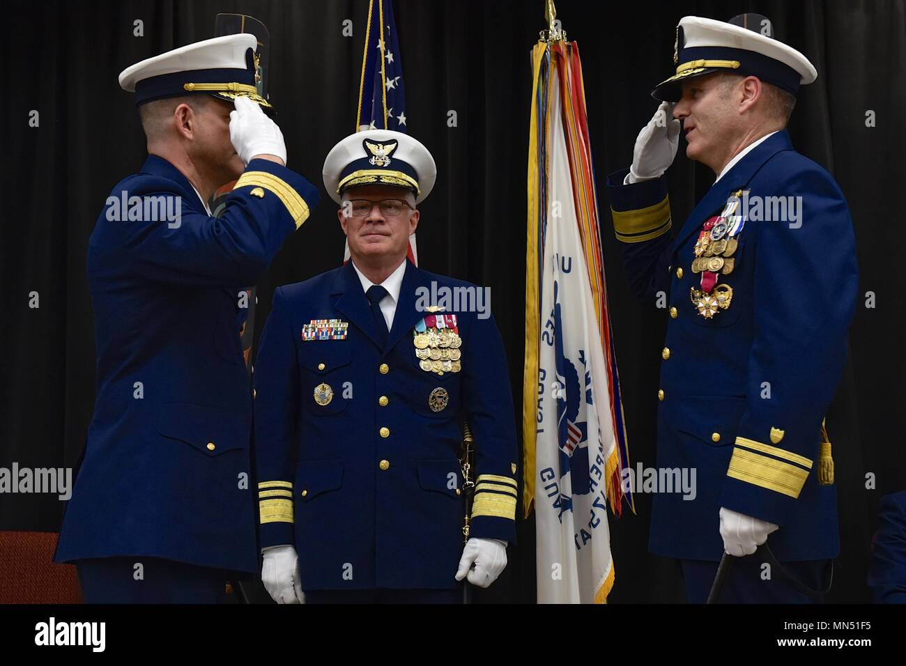 Vice Adm. Fred M. Midgette, watches while Rear Adm. Matthew T. Bell Jr ...