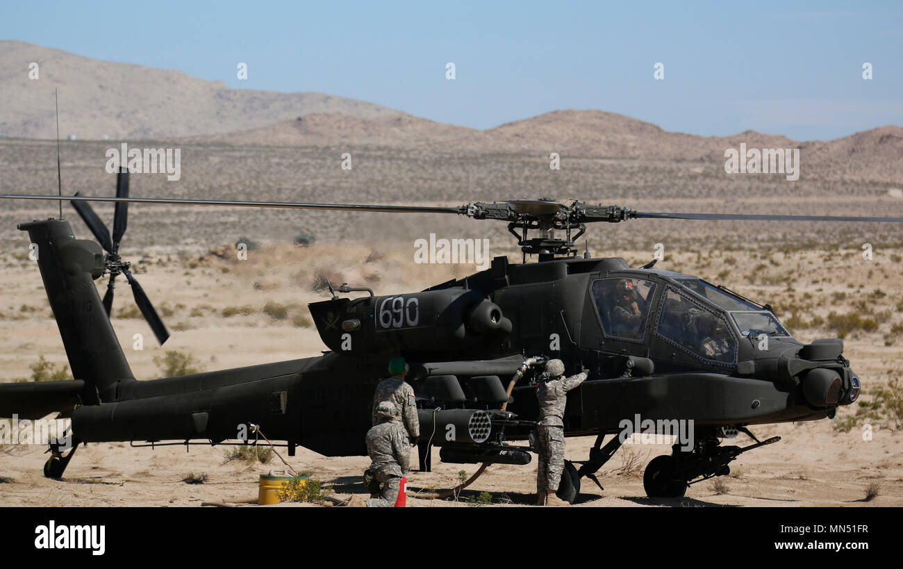 An AH-64 Apache helicopter refuels at Task Force Ragnar’s forward ...