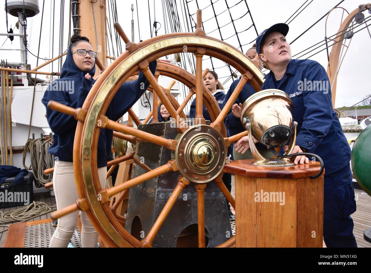 Students from the New London High School ROTC help steer the Coast ...
