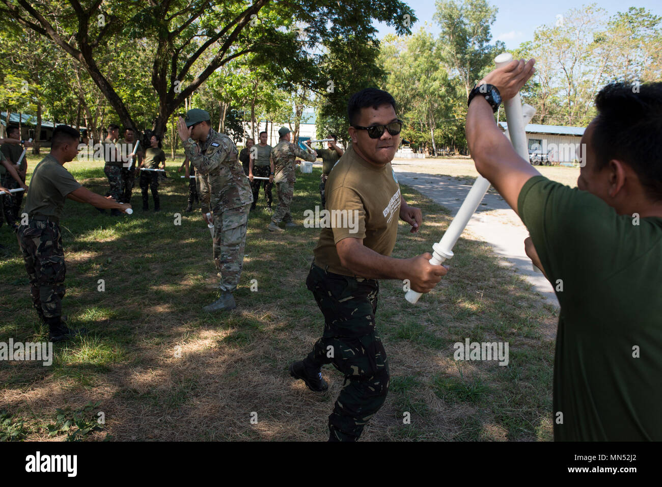 Philippine and U.S. Air Force airmen team up to practice wielding a ...