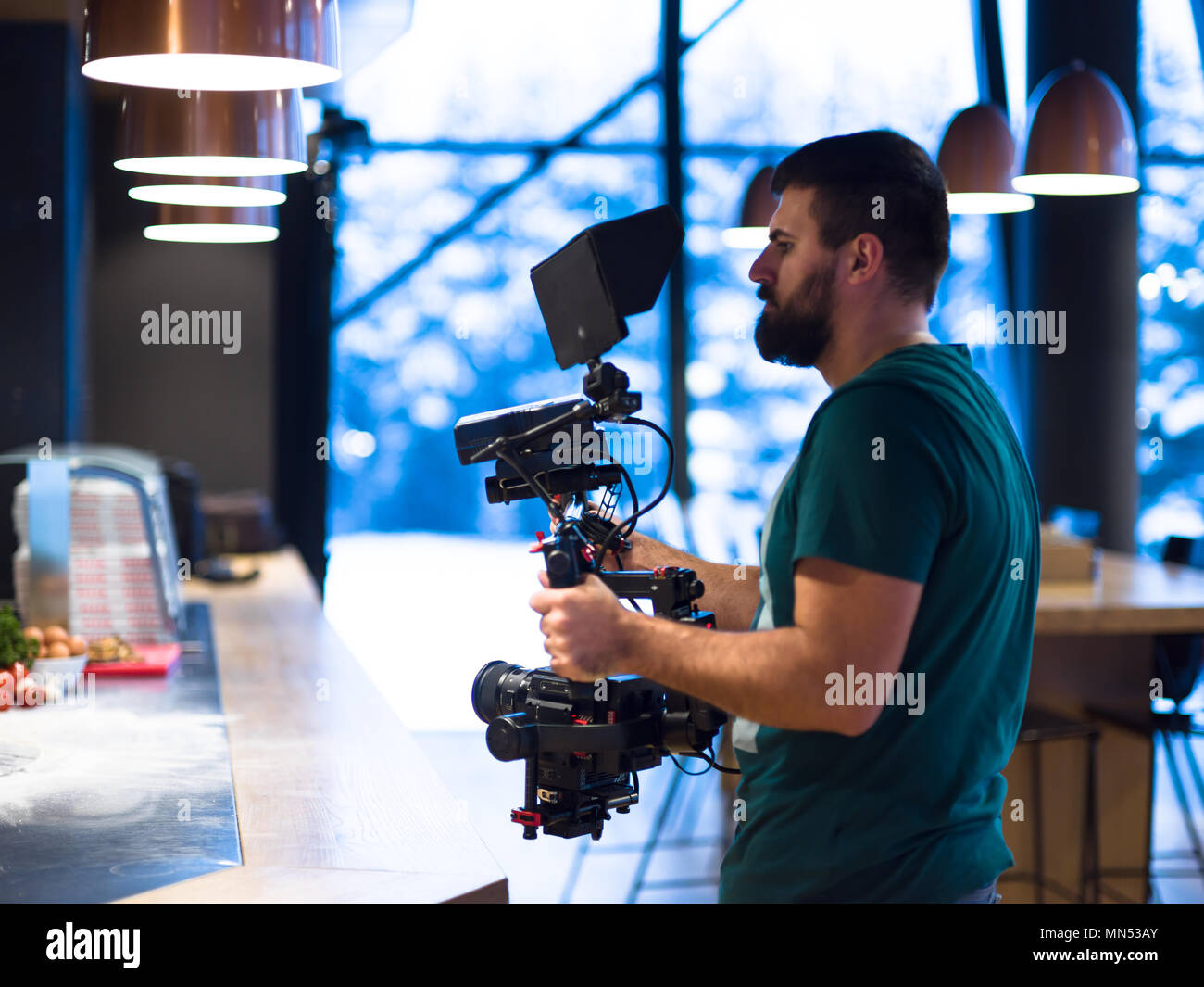 videographer recording while Professional team cooks and chefs ...