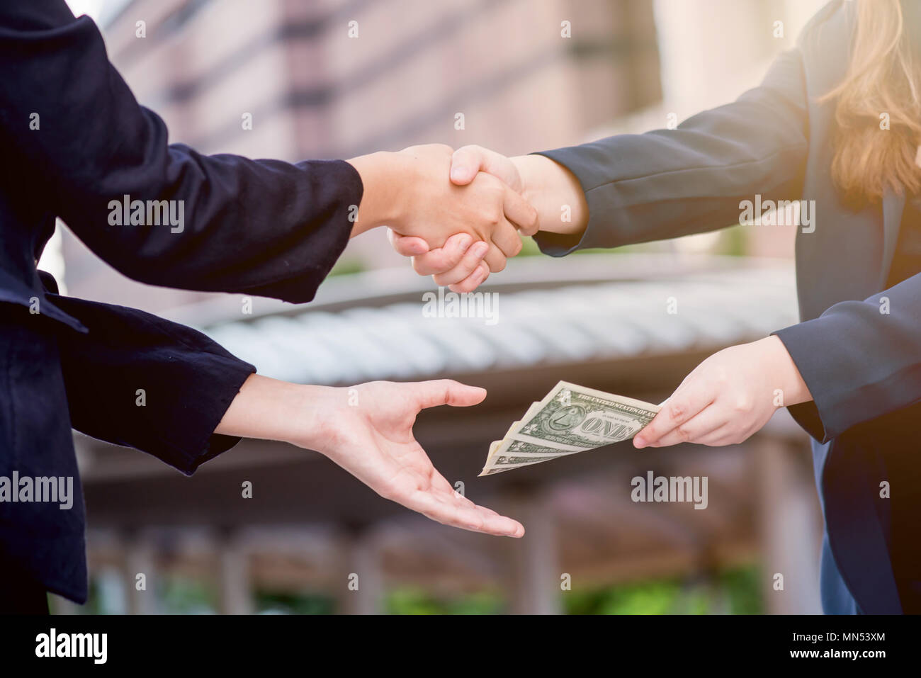 business handshake and teamwork for money and success goal Stock Photo ...