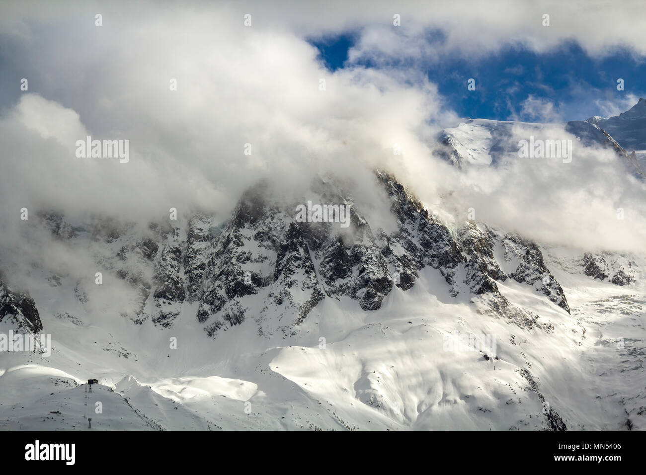 Breathtaking aerial view of Mont Blanc mountain peak covered with shiny ...