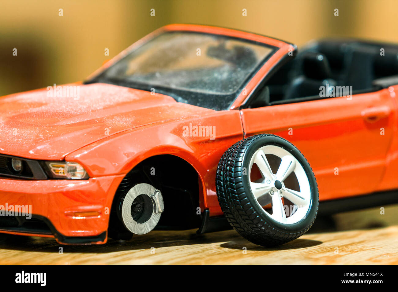 Close-up of rear view of red toy car after road accident Stock Photo ...