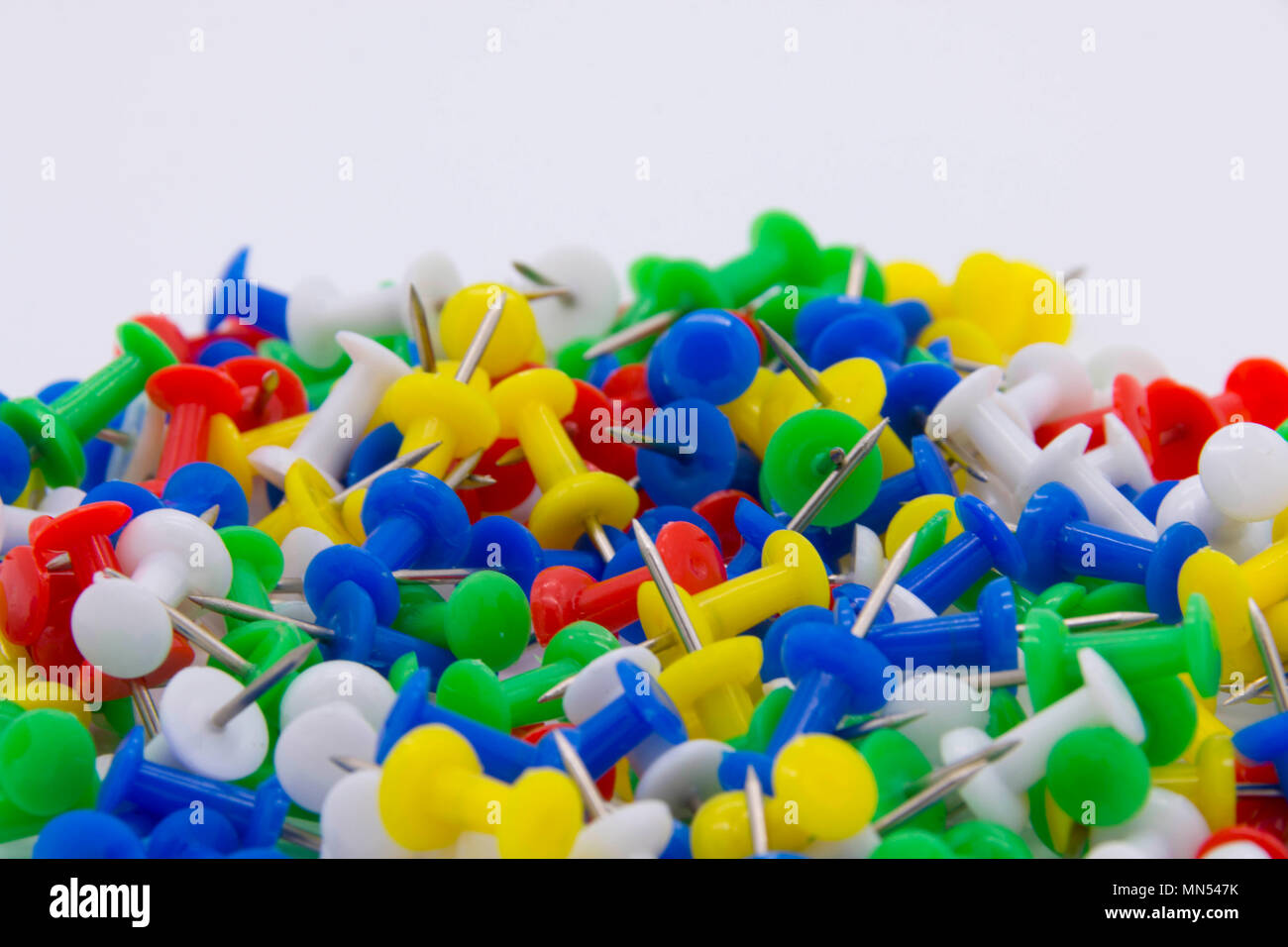 Pile of plastic notice board push pins on a white background Stock ...