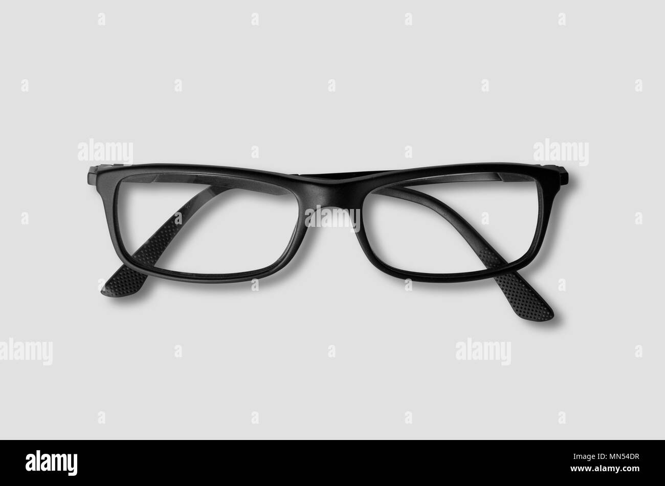Black eye glasses isolated on grey background Stock Photo - Alamy