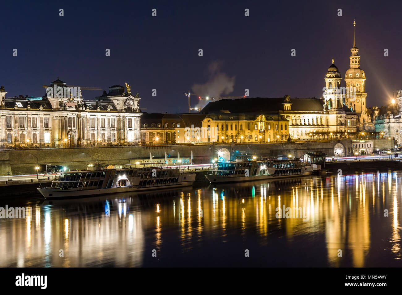 Night cityscape view of historic buildings with reflections in Elbe ...