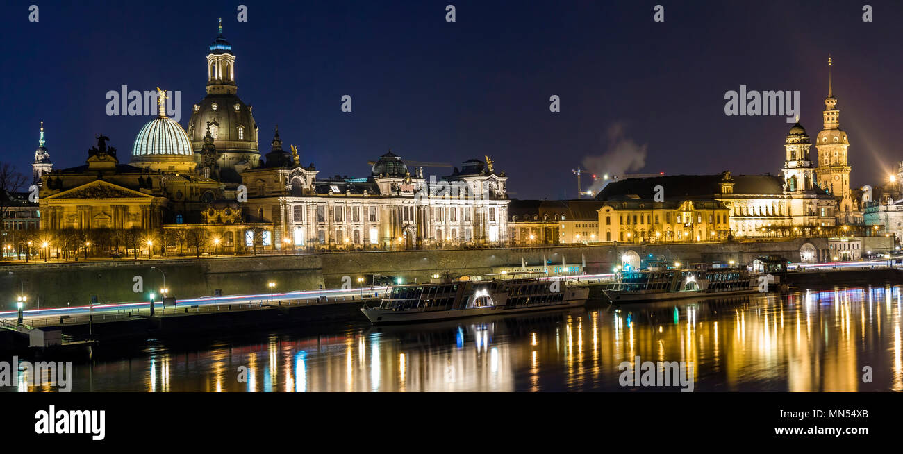 Night cityscape view of historic buildings with reflections in Elbe ...