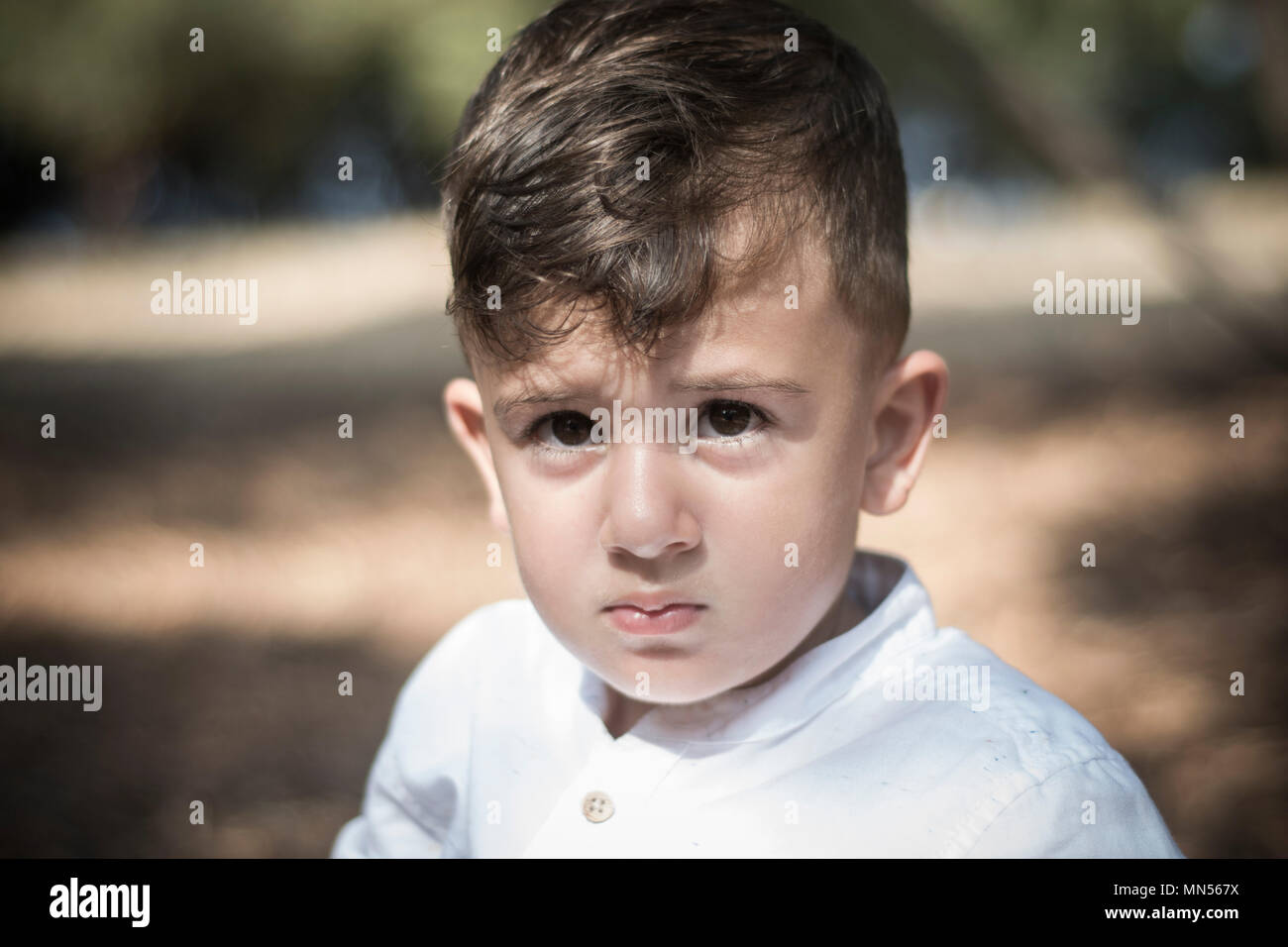 Sad little boy outdoors Stock Photo - Alamy