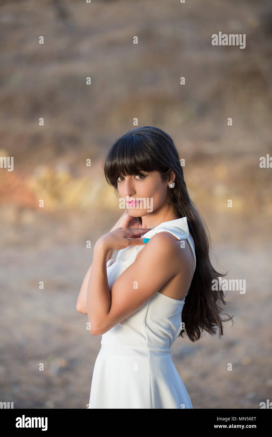 Beautiful woman standing outdoors Stock Photo - Alamy
