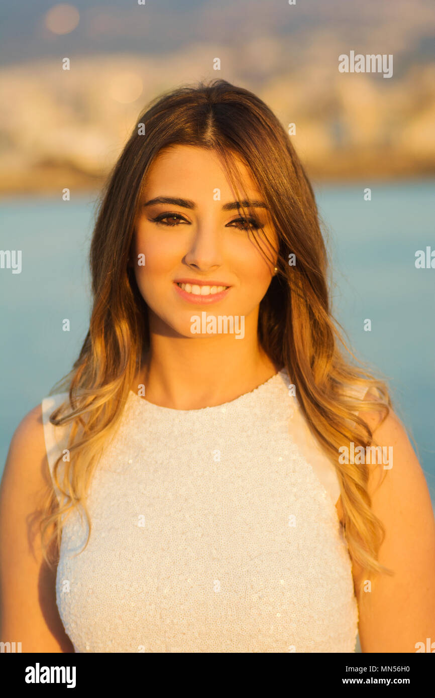 Beautiful woman smiling outdoors Stock Photo - Alamy