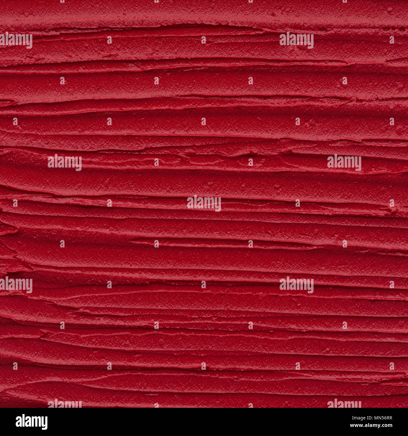 Red matte texture of lip gloss background. Red creamy lipstick texture ...
