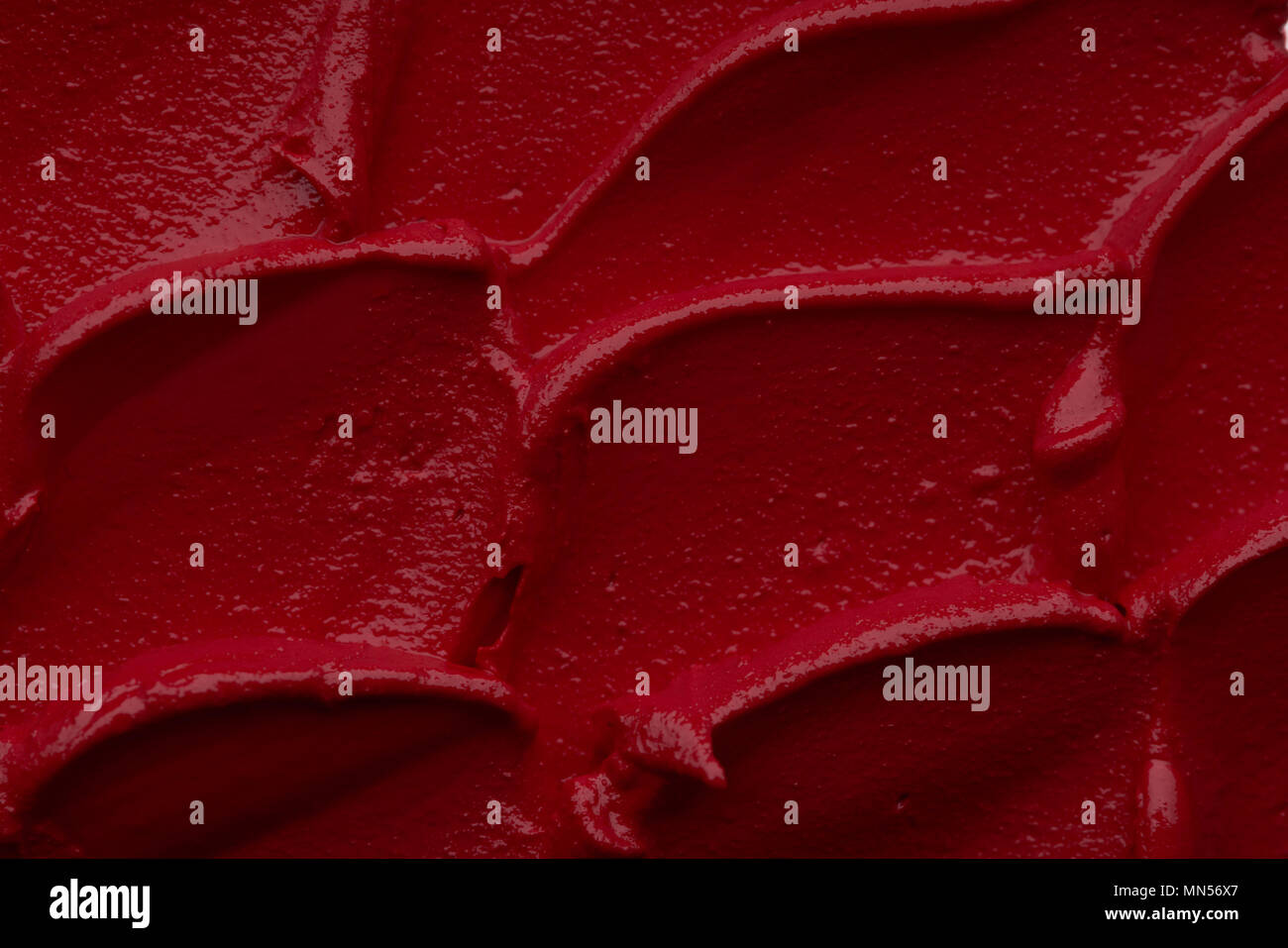 Red matte texture of lip gloss background. Red creamy lipstick texture ...