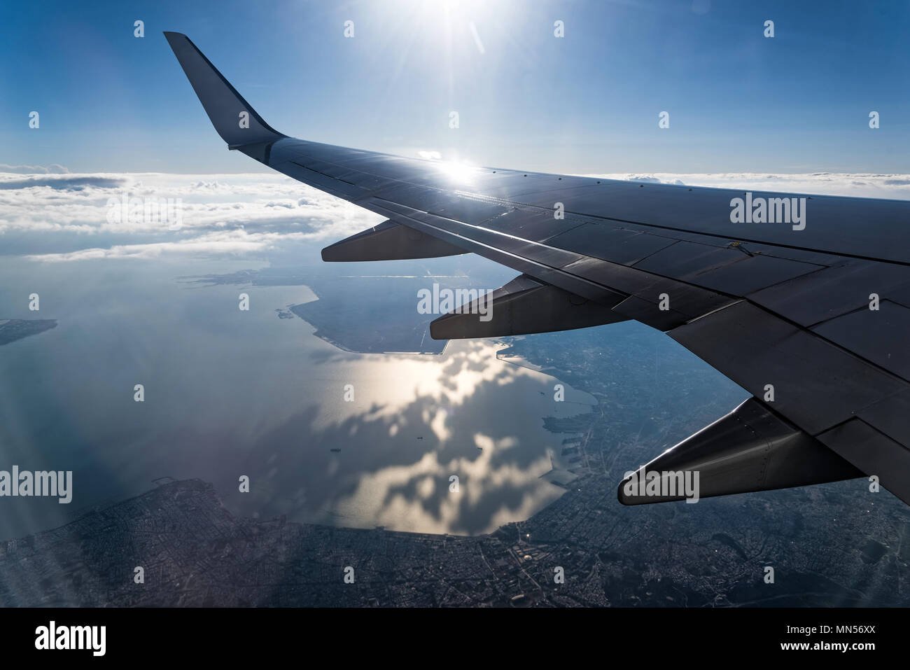View through the window of the wing of an airplane flying above the ...