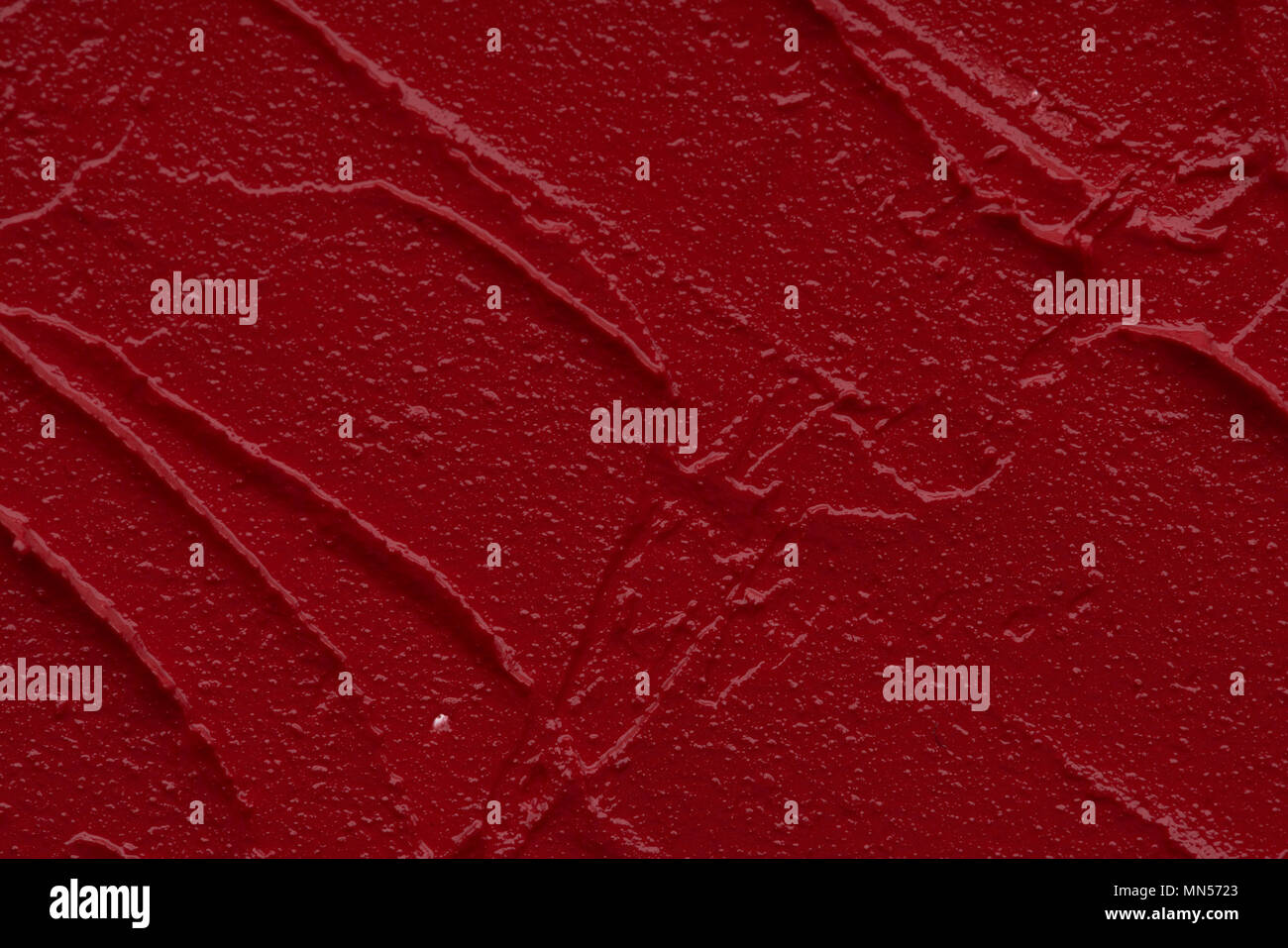 Red matte texture of lip gloss background. Red creamy lipstick texture ...