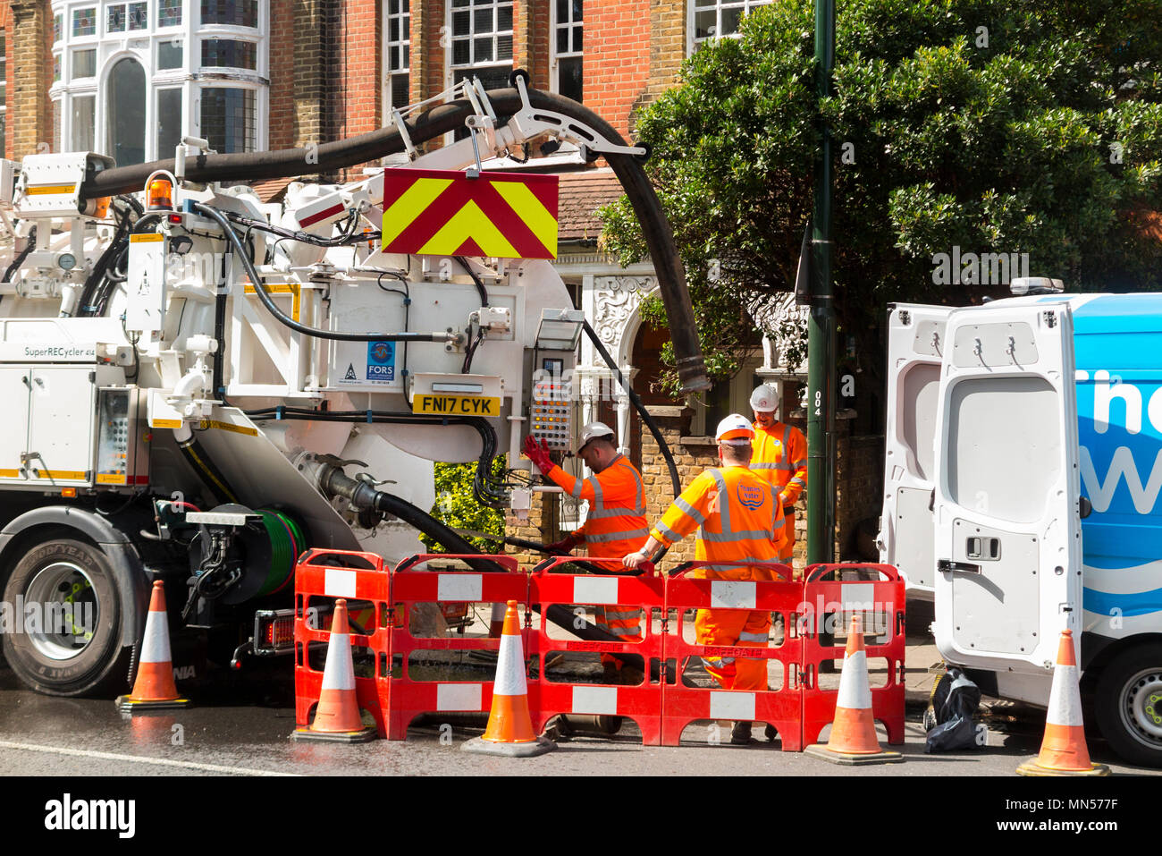 Thames water lorry van vans vehicles at the site of a blocked pipe drain drainage sewer blockage attended by their staff and workers in Twickenham West London. UK 96 Stock Photo Alamy