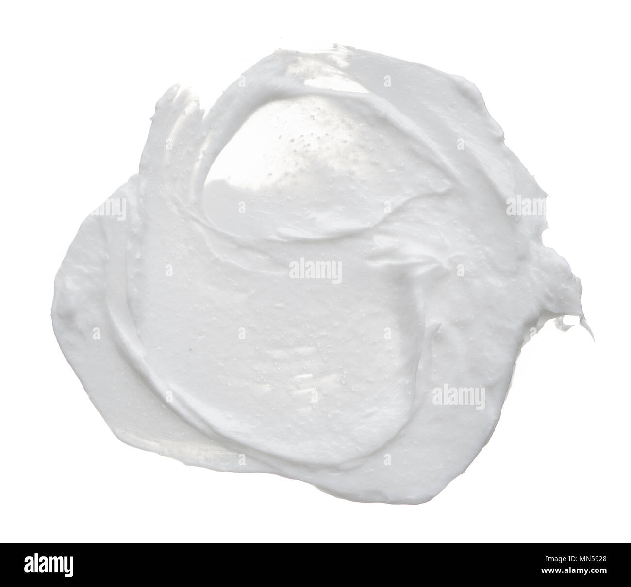 White ?reamy texture isolated on white background. Smear of face cream ...