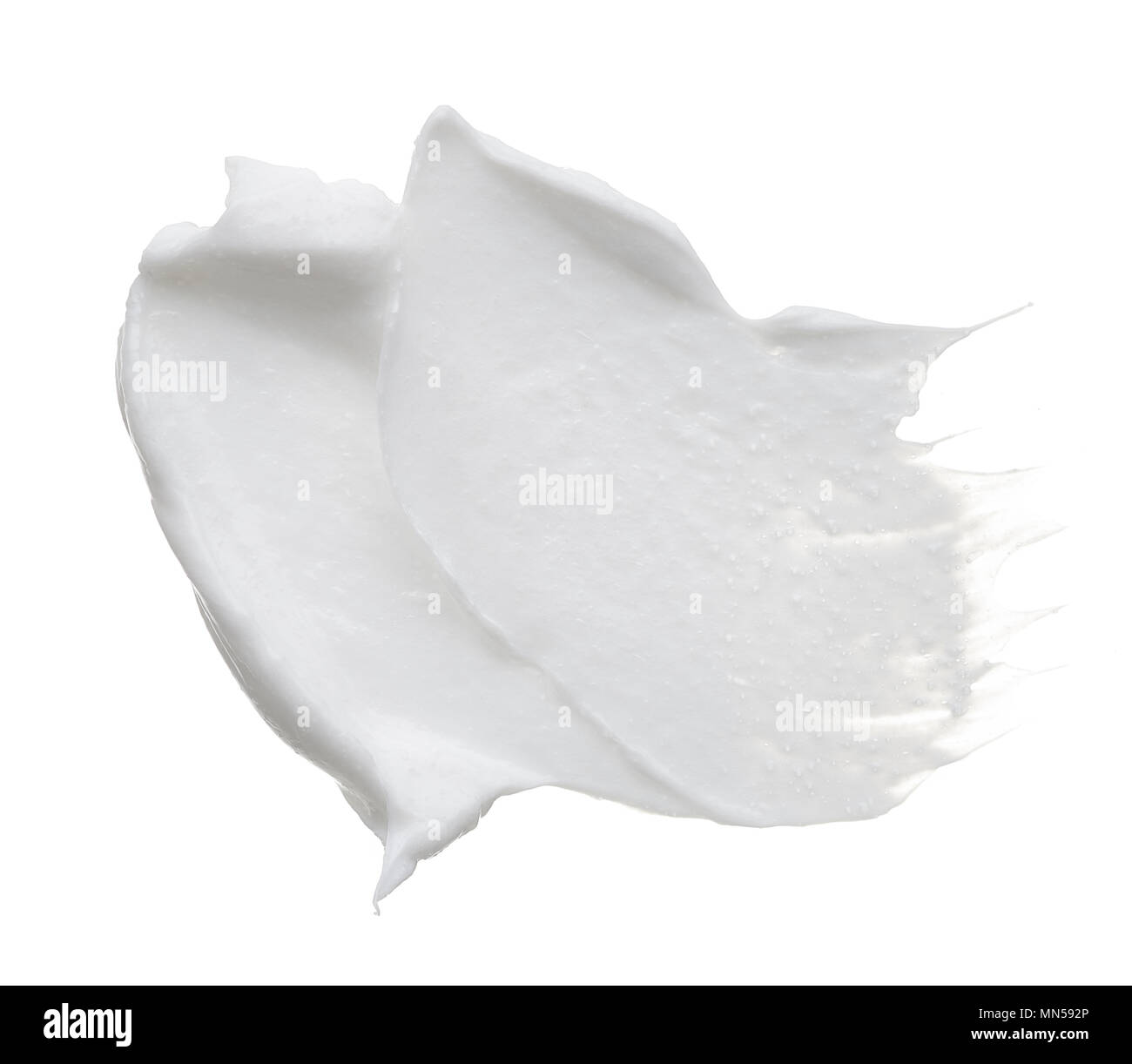 White ?reamy texture isolated on white background. Smear of face cream ...