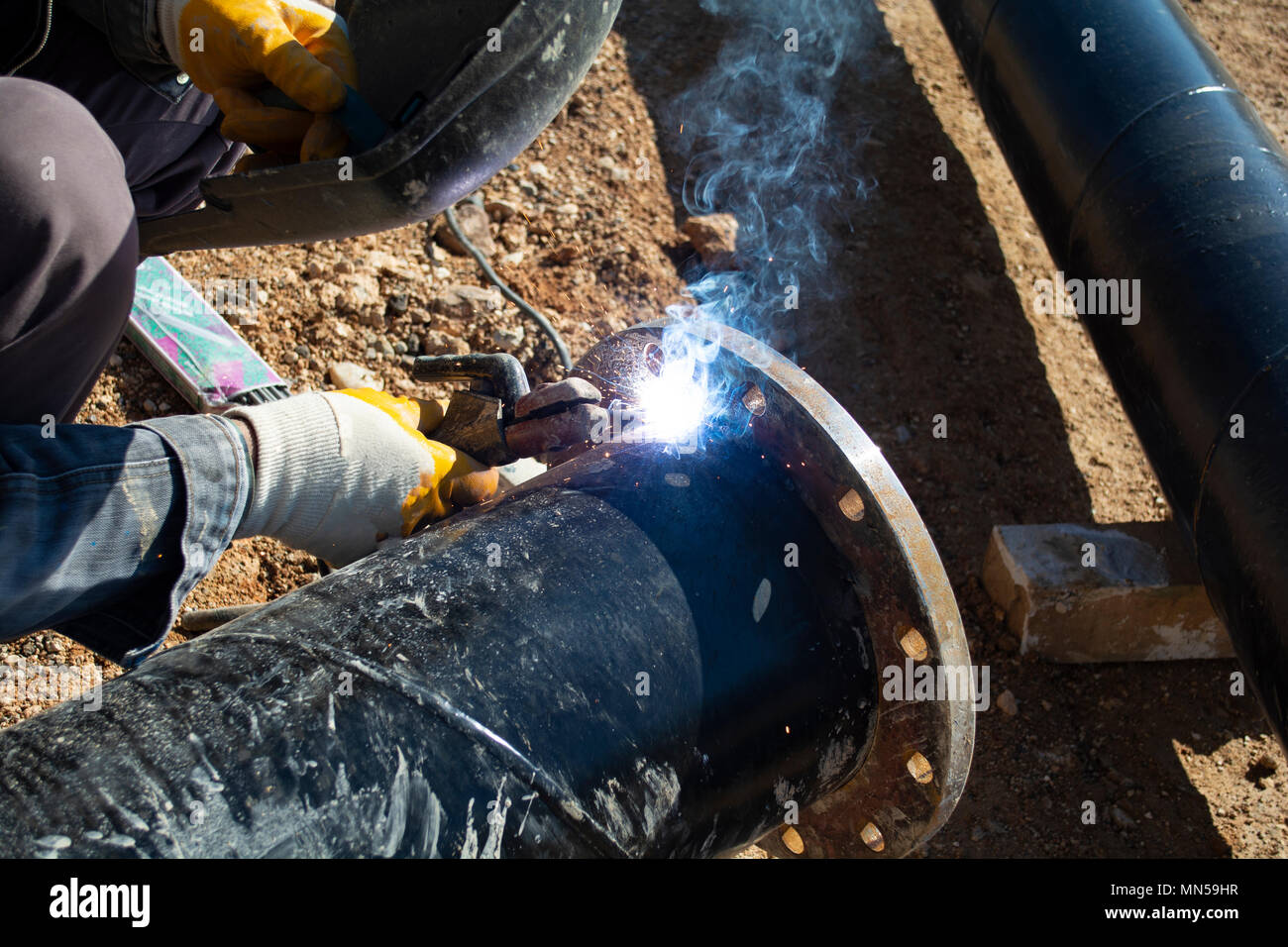 Welder mounts in the trunk pipeline electrochemical protection Stock ...