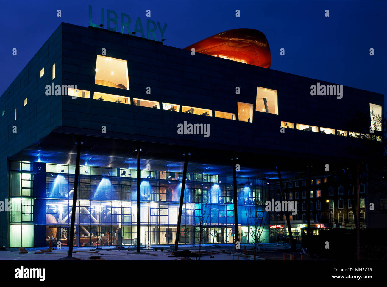 Night elevation with lit interiors. Peckham Library, London, United ...