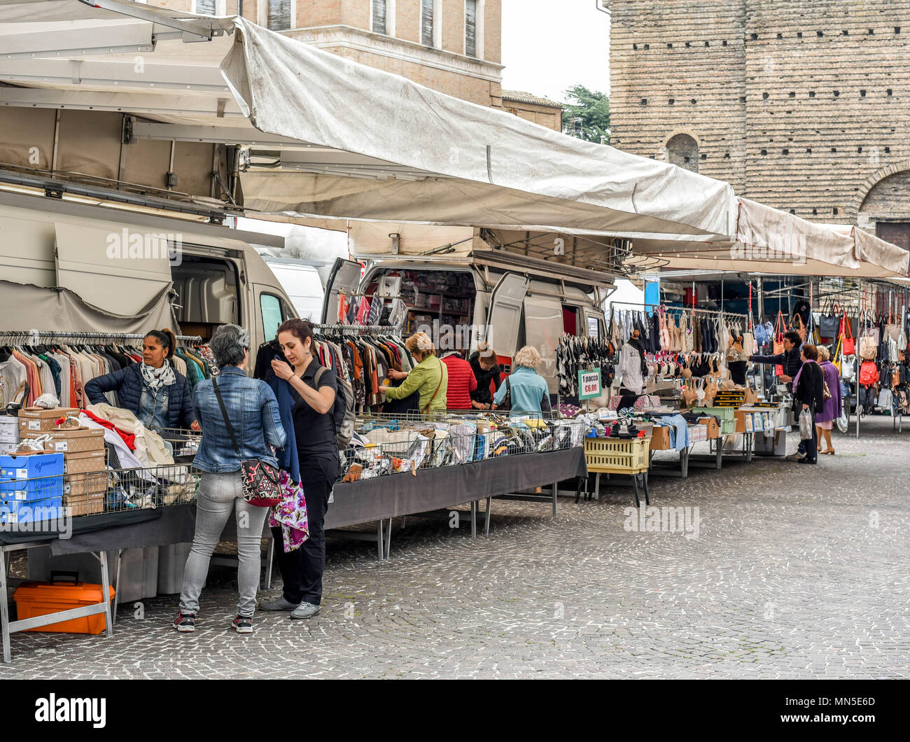 Ladies chatting by Italian market stall Stock Photo - Alamy