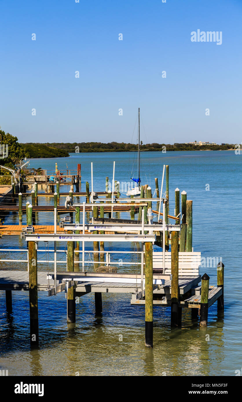 Dock with Boat Lifts in Harbor Stock Photo - Alamy
