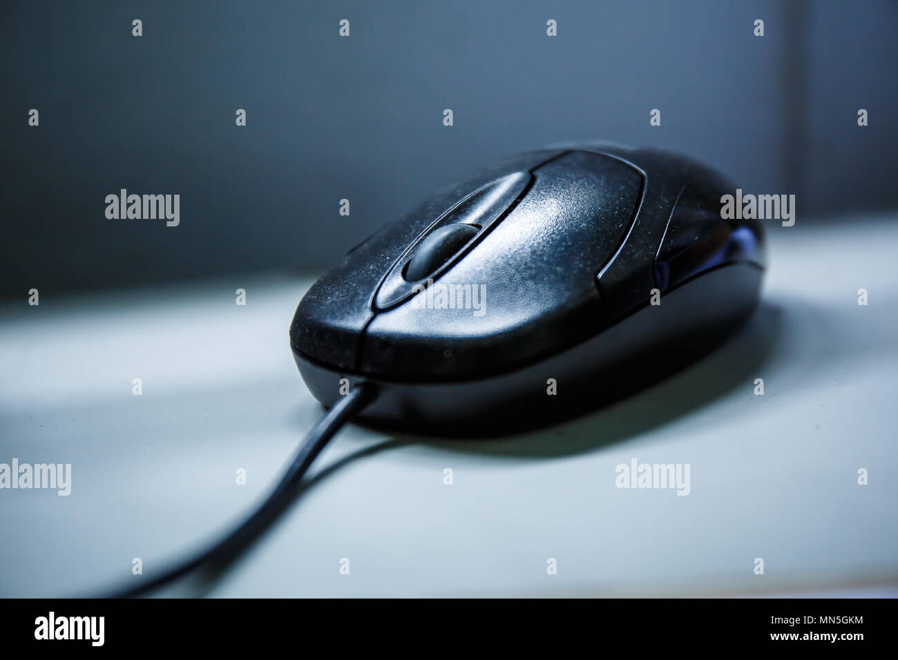 Black computer mouse on a black background Stock Photo - Alamy