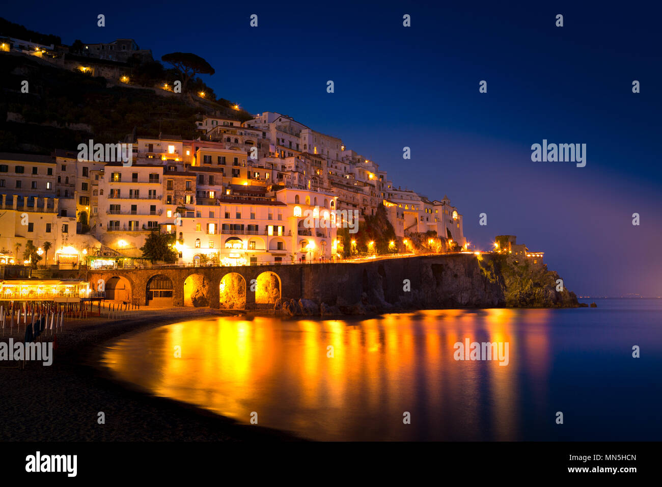 Night view of Amalfi on coast line of mediterranean sea, Italy Stock ...