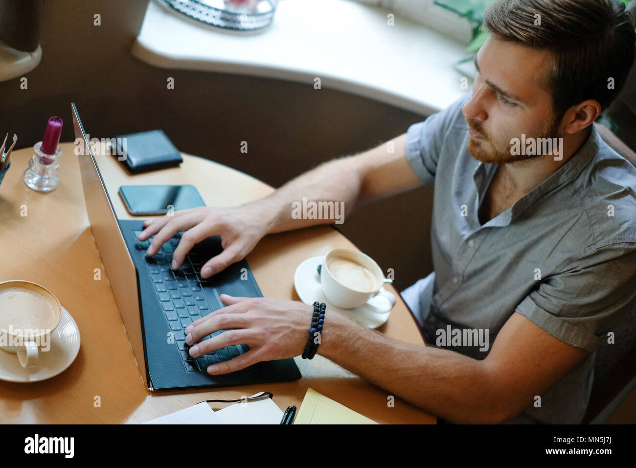 Job. Freelancer at work in the cafe Stock Photo - Alamy