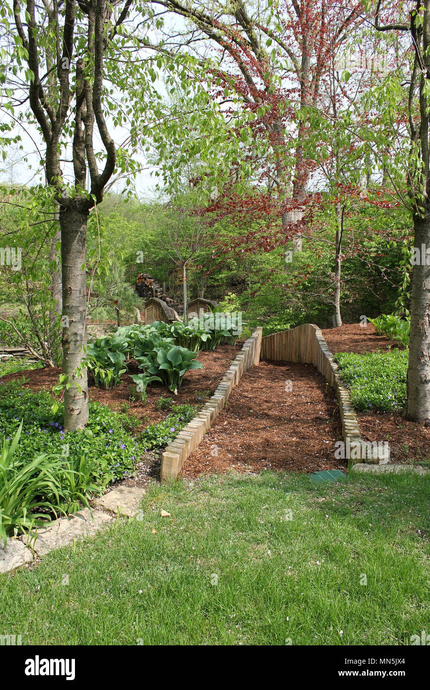View.of beautiful professional landscaping in the backyard of an ...