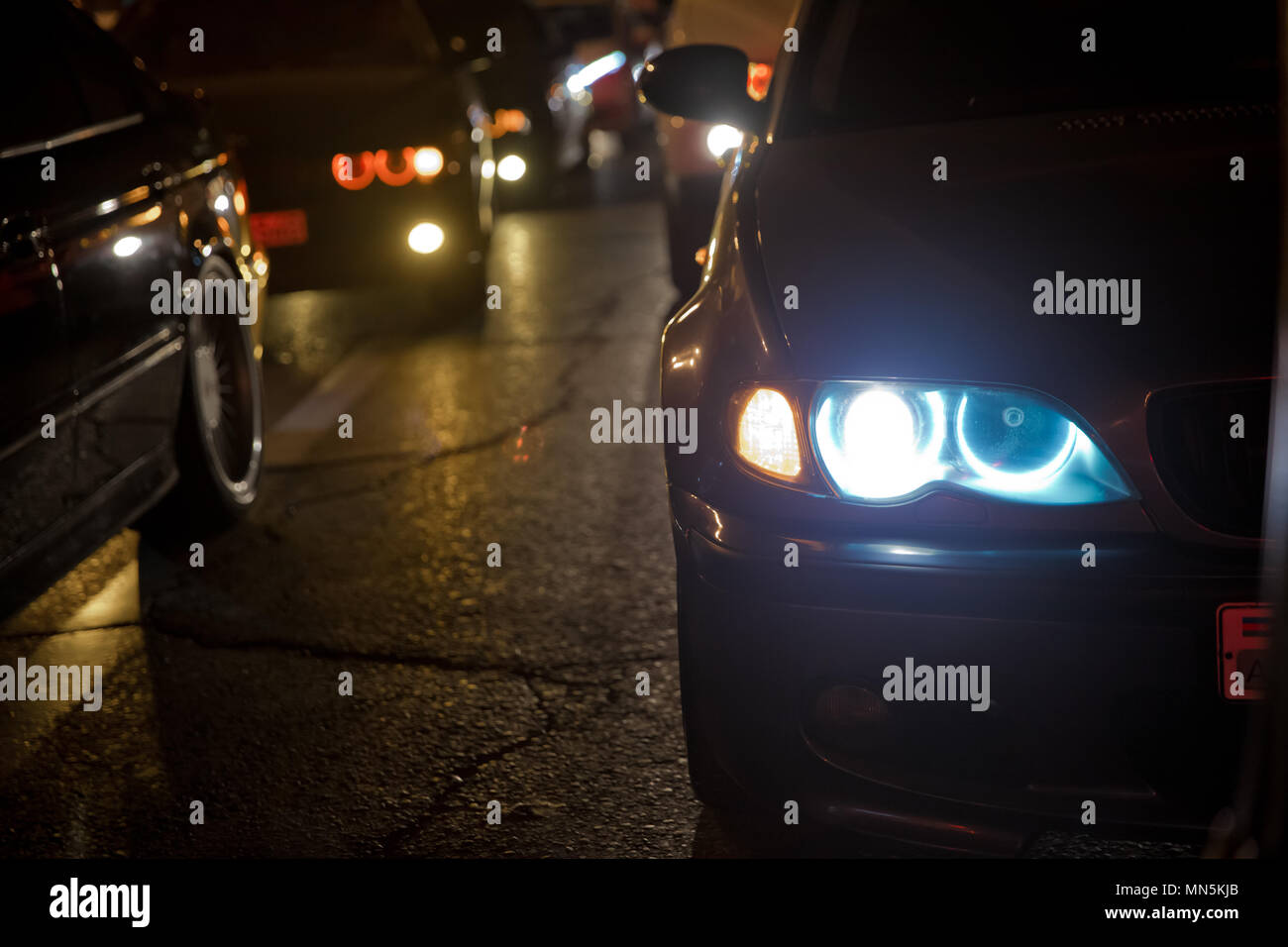 Night view of the cars. Road in the city at the night with yellow and ...