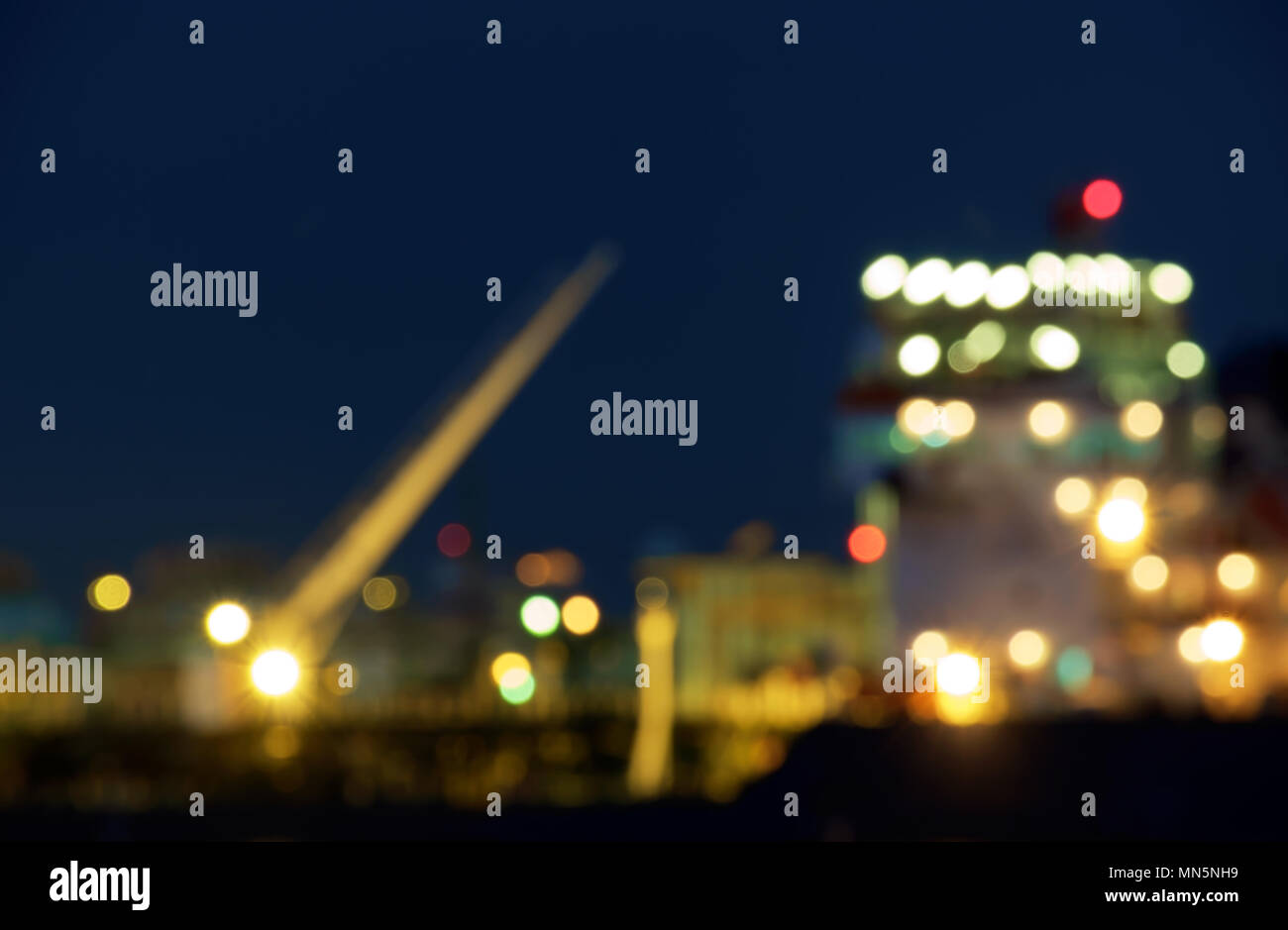 Abstract blur background of Oil refinery reflex on river at night Stock ...