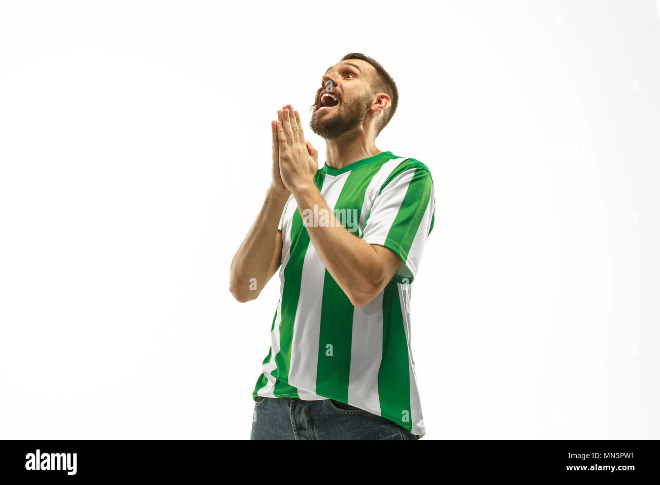 Irish fan celebrating on white background Stock Photo - Alamy