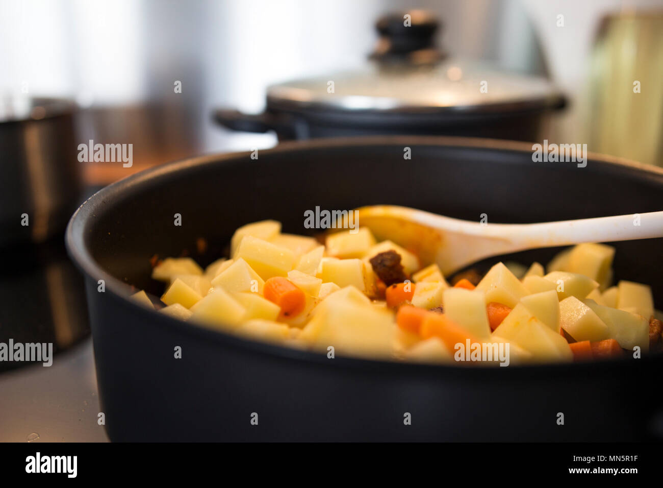 Making food in a kitchen Stock Photo - Alamy