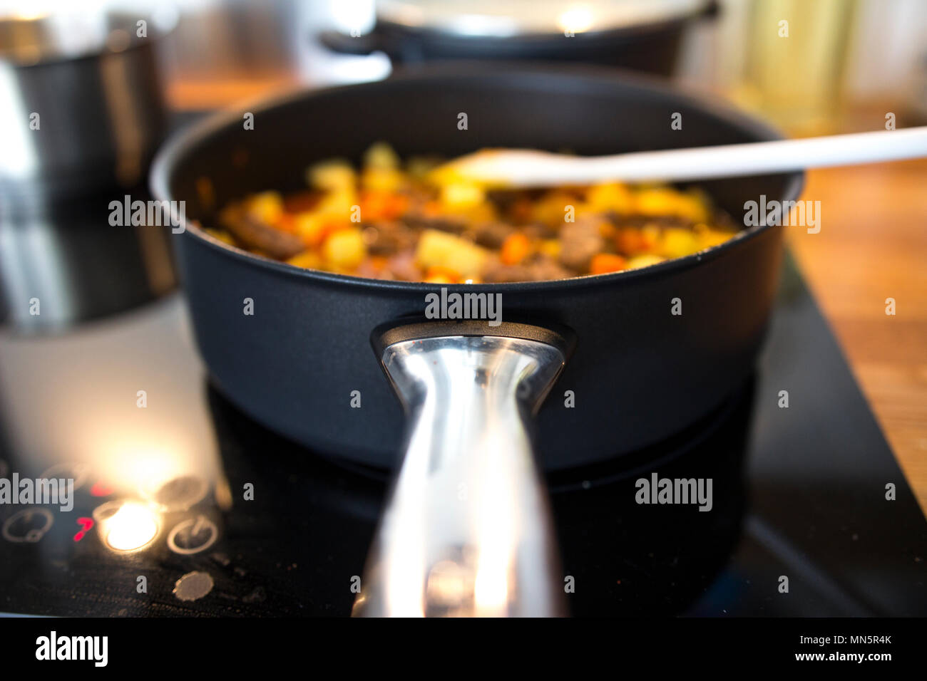 Making food in a kitchen Stock Photo - Alamy