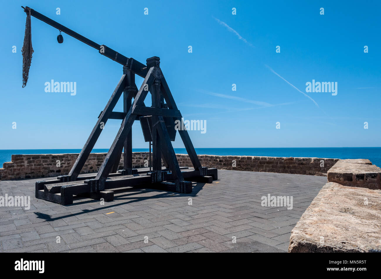 ancient catapult on the ramparts of Alghero in spring Stock Photo - Alamy