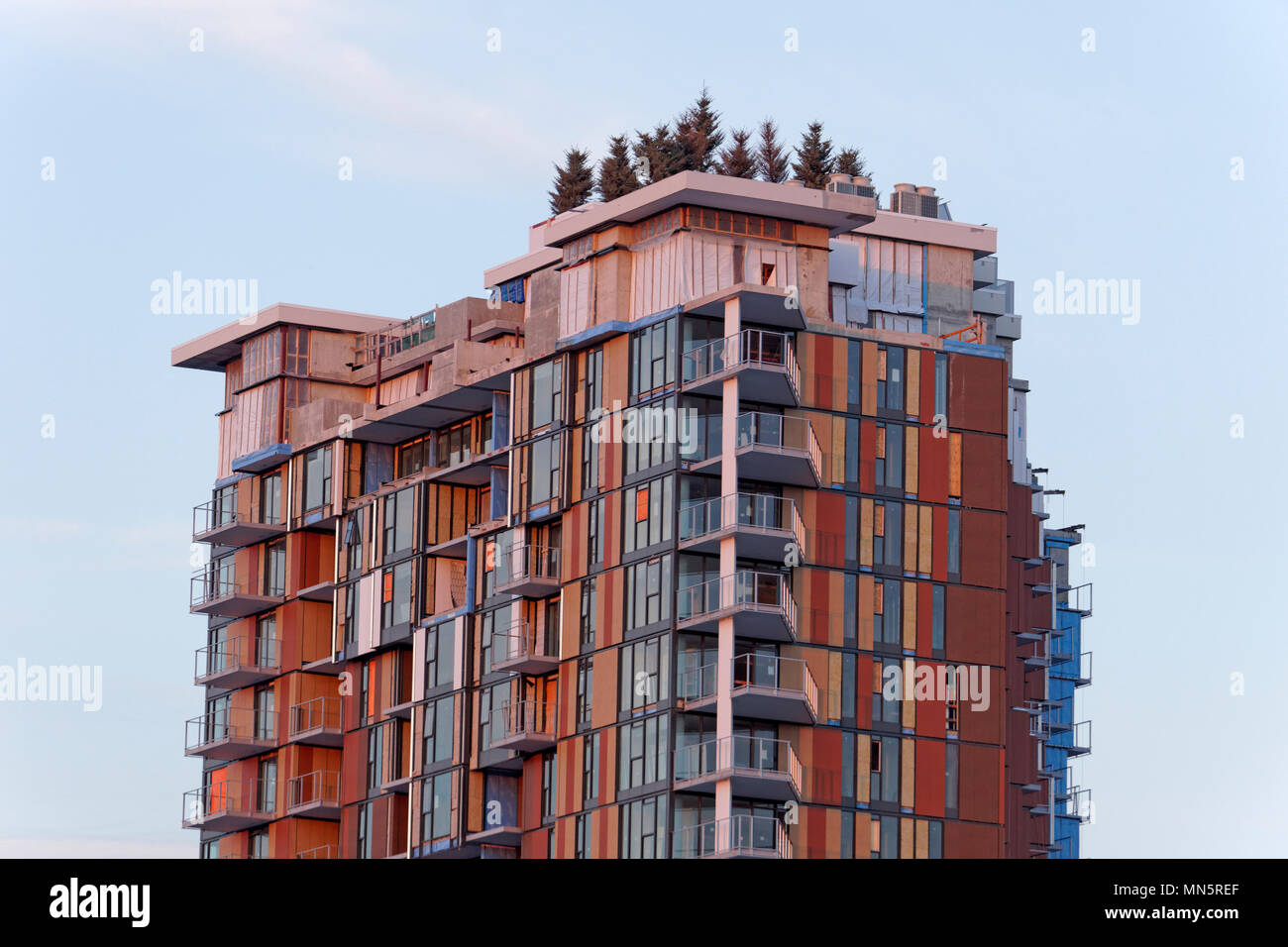 New residential high rise residential building with rooftop vegetation ...