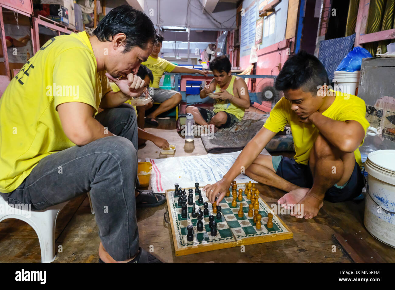 Inmates play chess in their crowded cell block in the Manila City Jail ...