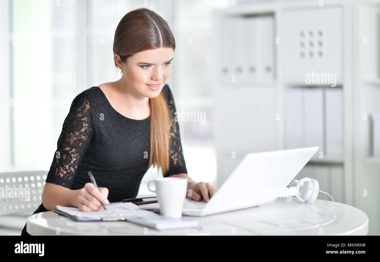 Young attractive woman working Stock Photo - Alamy