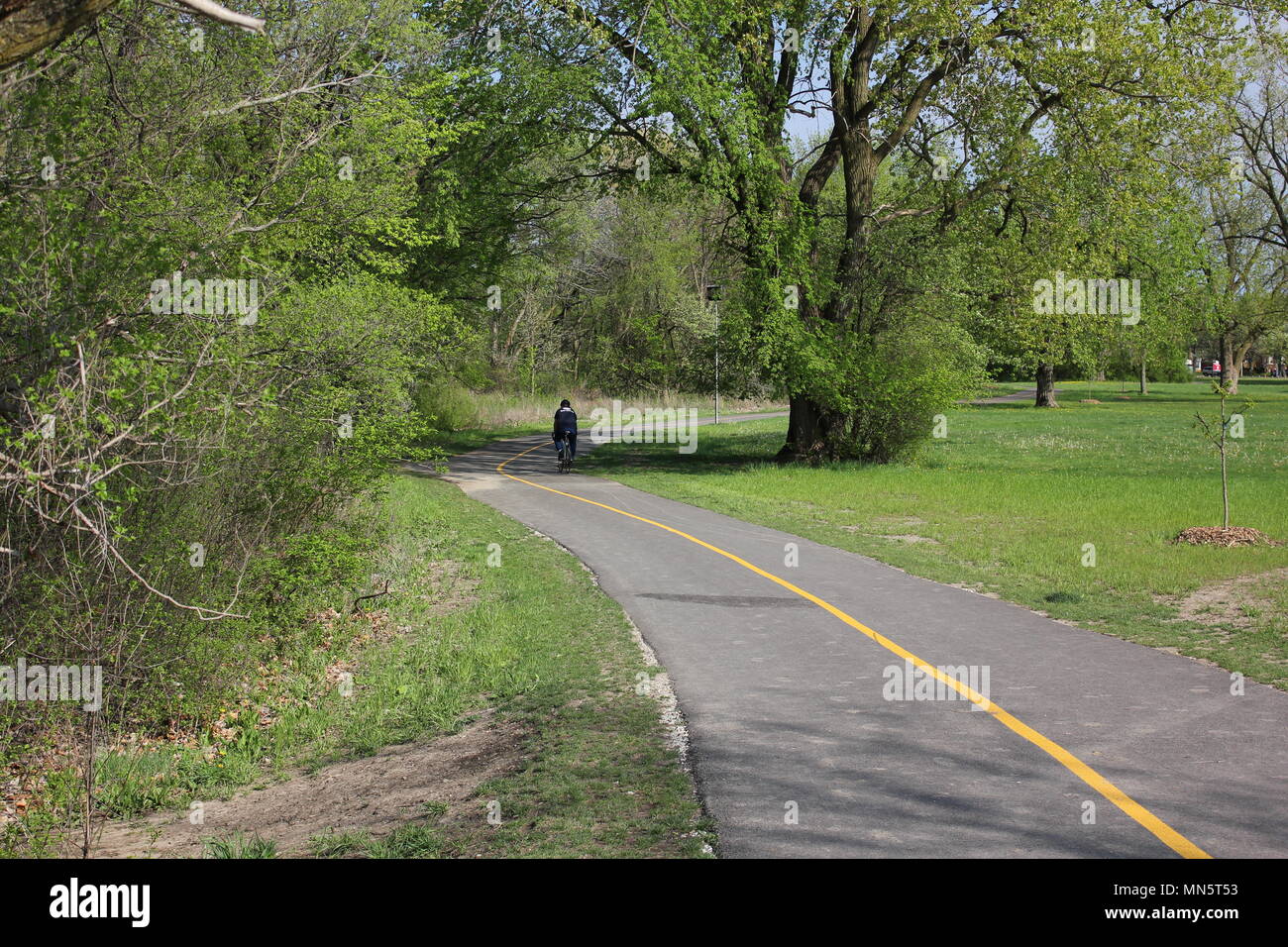 Recreation bicyclist cycling along a paved bike path Stock Photo - Alamy